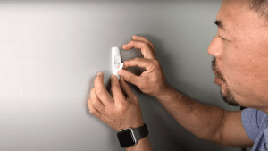 How to Remove Command Strips Without Damaging Your Walls - HelpWithDIY